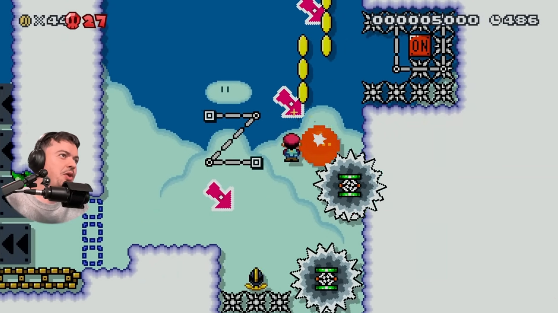 Playing Super Mario Maker 2 super expert level runs