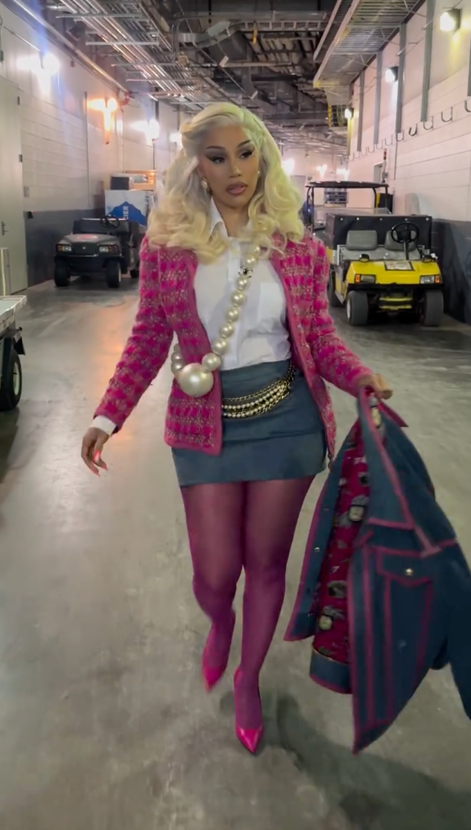 Cardi B and Stefon Diggs coordinate in archival Chanel at an NFL game
