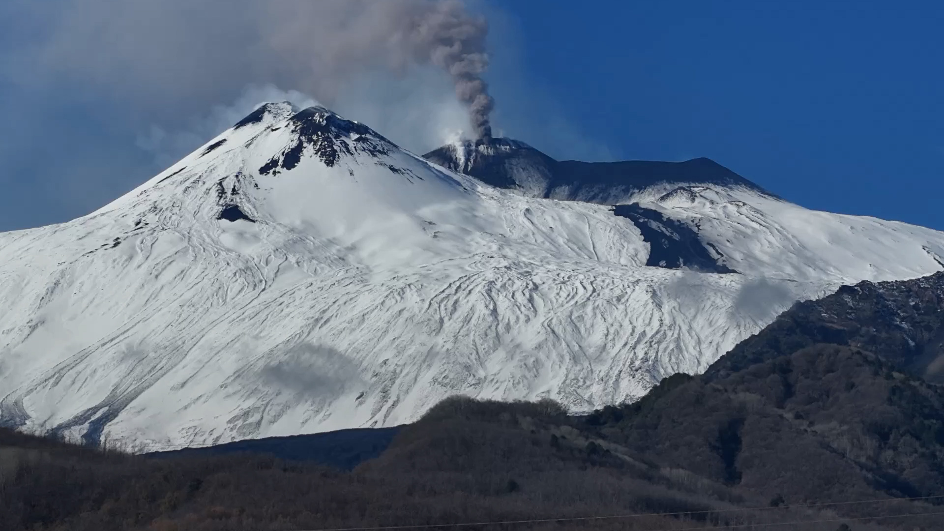 Mount Etna erupts from snow-covered craters in southern Italy