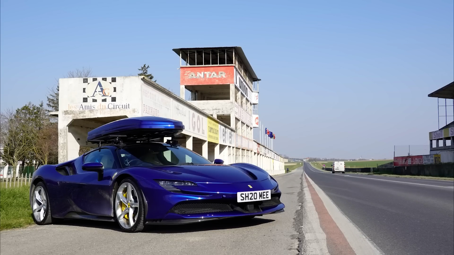 Ferrari SF90 with roof box at historic French circuit