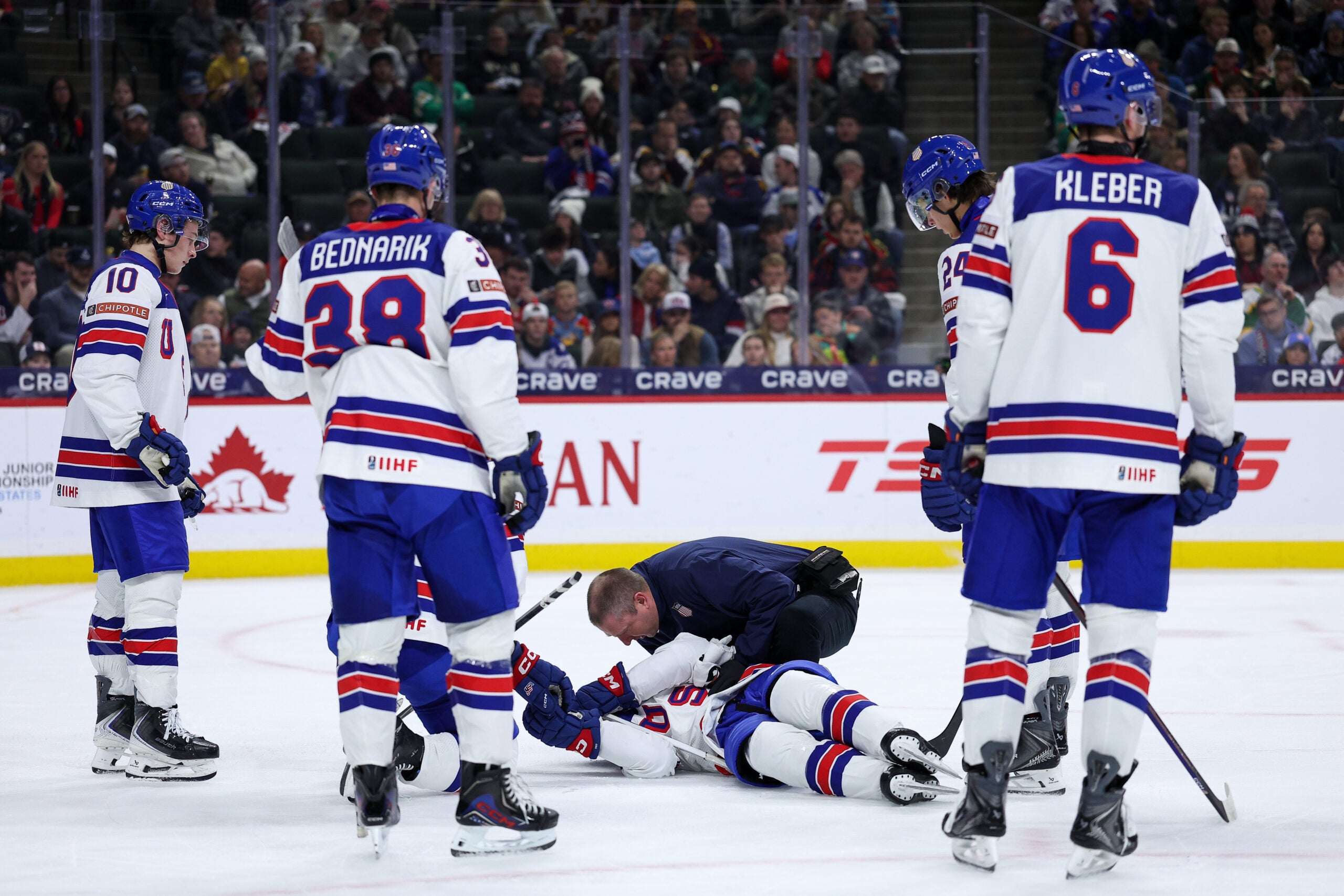 BU hockey’s Cole Hutson avoids major injury after taking puck to back ...