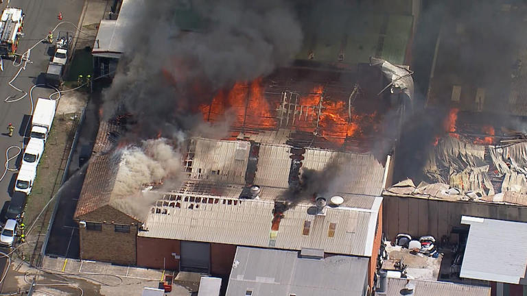 More than 60 firefighters work to extinguish factory fire in Sydney's west