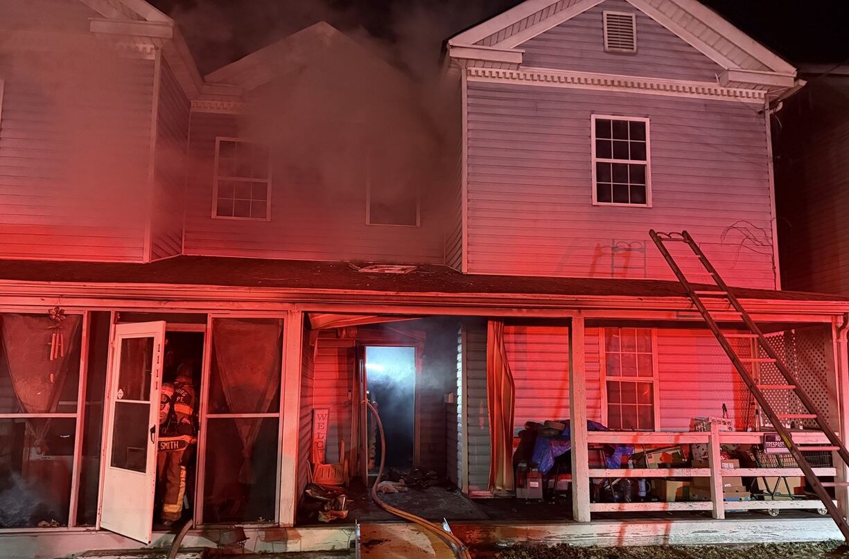 Update: Woman hospitalized after being rescued from house fire; cause ...