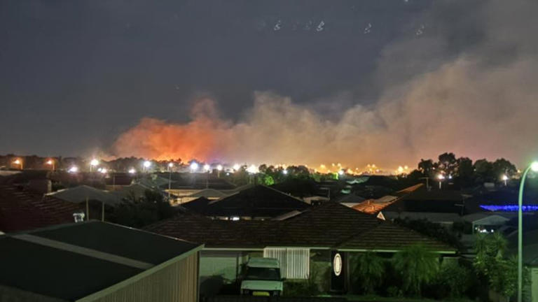 Out-of-control bushfire rages near homes