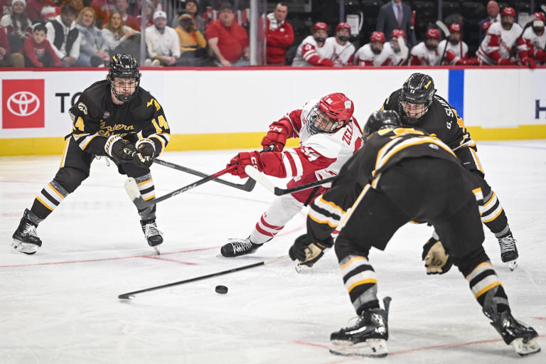 National champs keep Wisconsin in check for Kwip Trip Holiday Face-Off ...