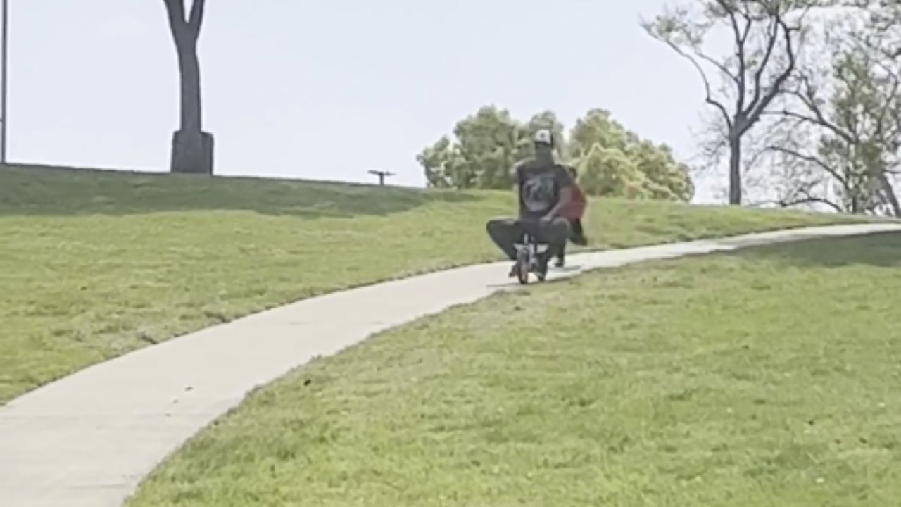 Hilarious park moment as kid trips while running behind his bike