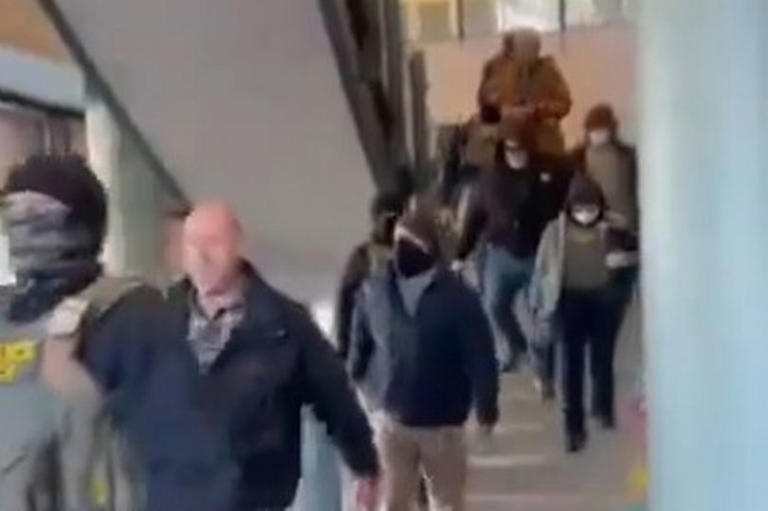 Dozens of ICE agents gather to detain one person in bizarre clip