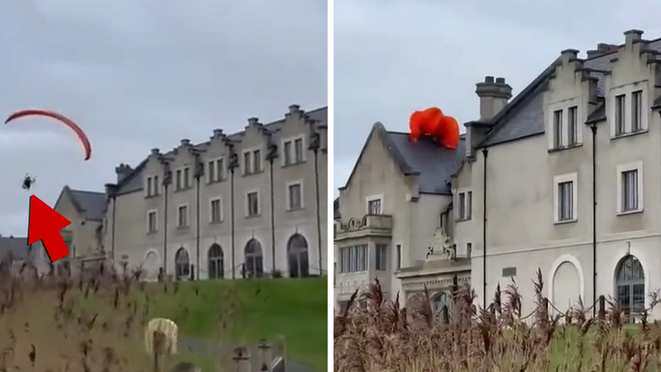 Paraglider crash-lands on hotel roof, dangles dangerously, on video