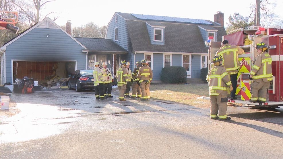 Fire officials tackle garage fire at Norton home