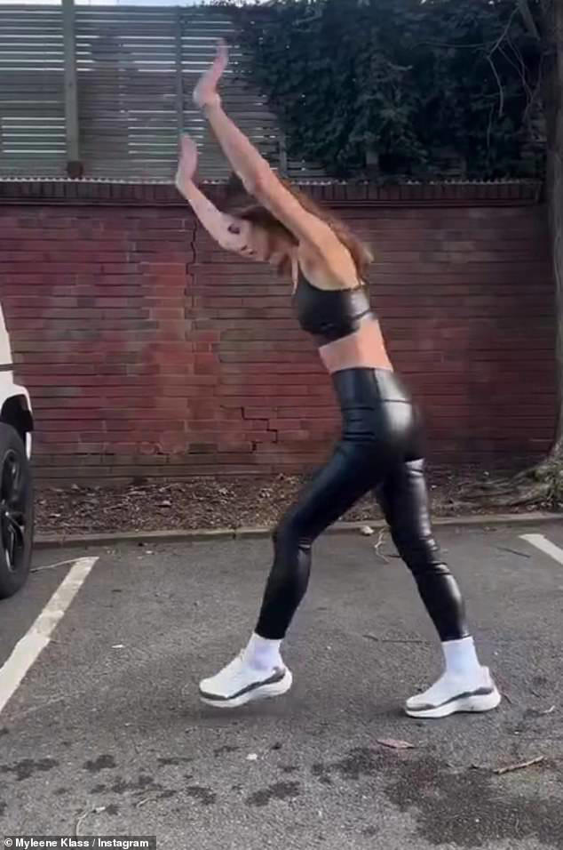 Myleene Klass, 47, shows off her incredible abs as she performs a ...