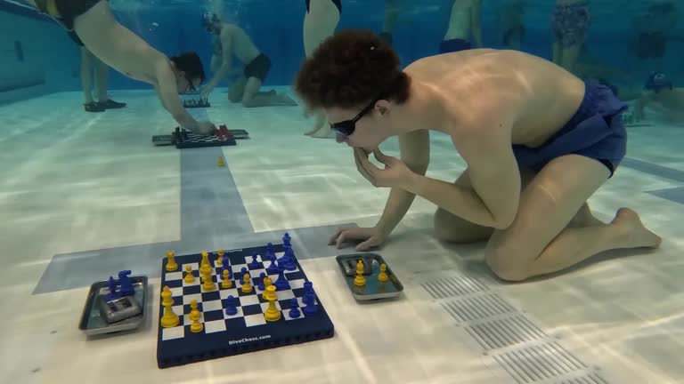 World champ crowned as diving chess players battle it out on submerged ...