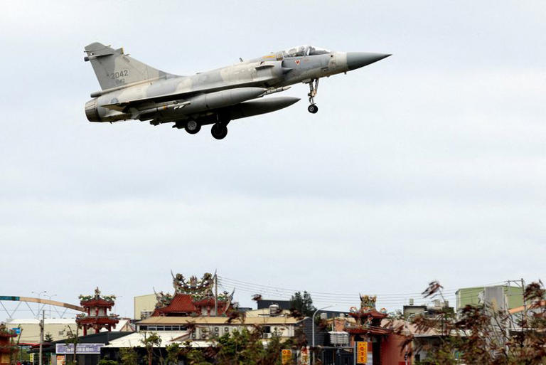 Taiwan stays on high alert as Chinese ships pull back after massive drills