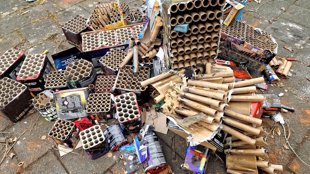 Who is responsible for cleaning up the firework debris?