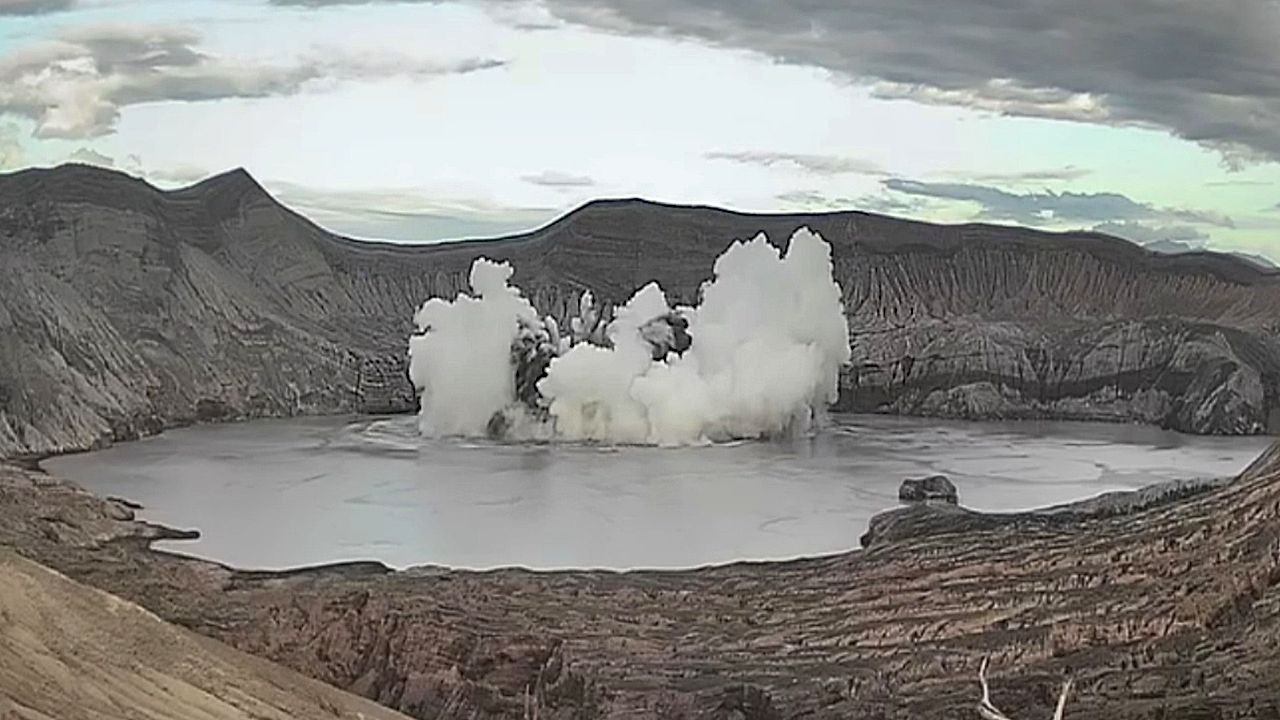 Volcanic eruption sends towering plume over crater lake in Philippines