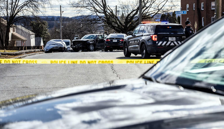 Harrisburg police shut down street after crash, possible shooting