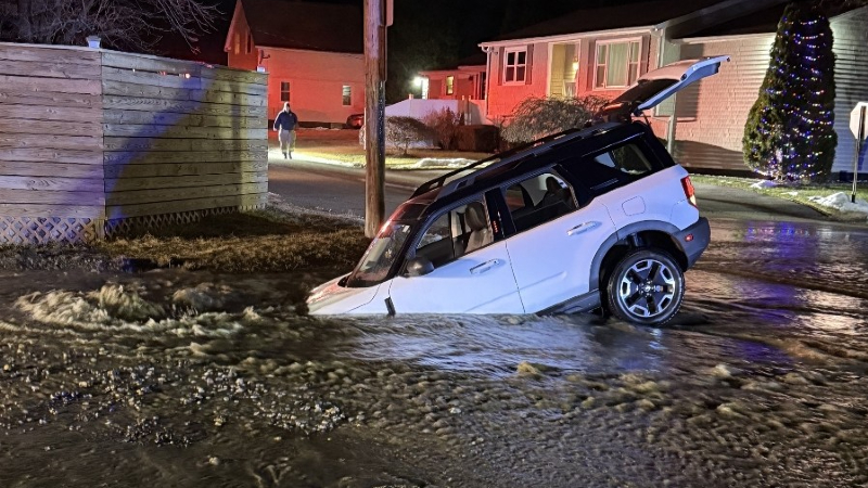 Car gets stuck in Cranston sinkhole
