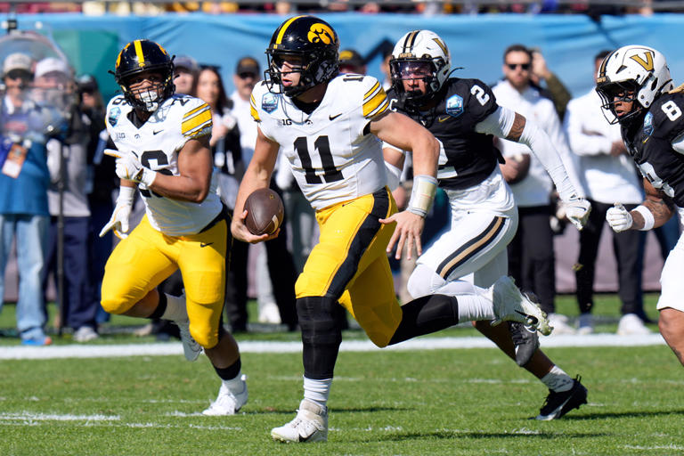 Vanderbilt punter's illegal kick sets up Iowa for an easy touchdown in ...