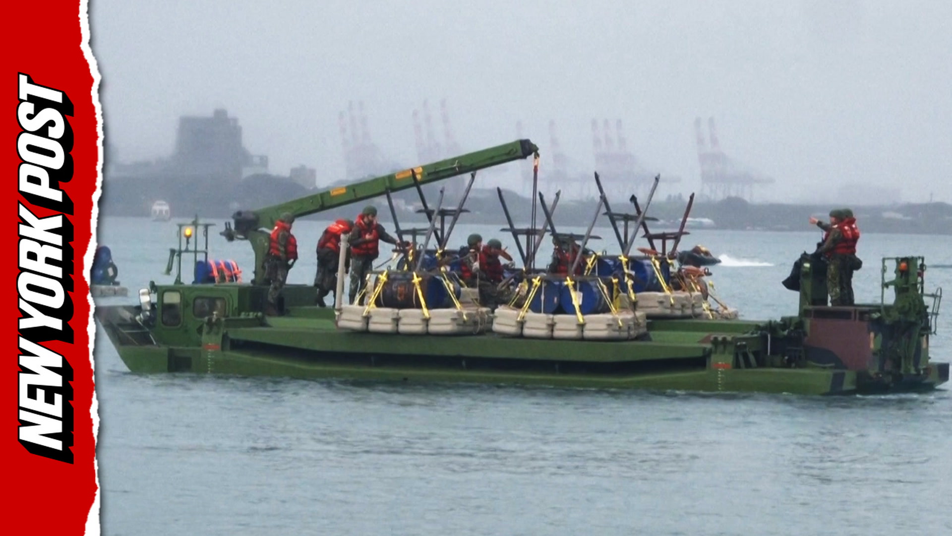 Taiwan drops explosive barrels in river defense drill as China ...