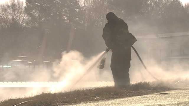 Brush fire burns at least 20 acres, threatens hunting camp