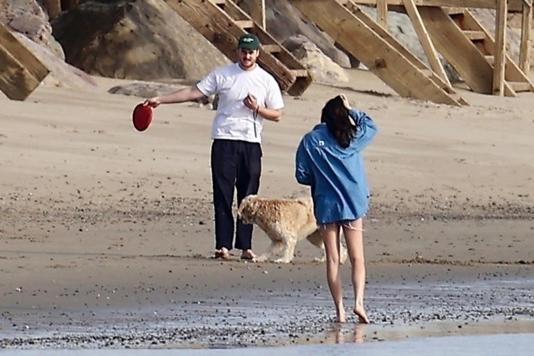 Romy Reiner looks solemn on beach walk with boyfriend after parents ...