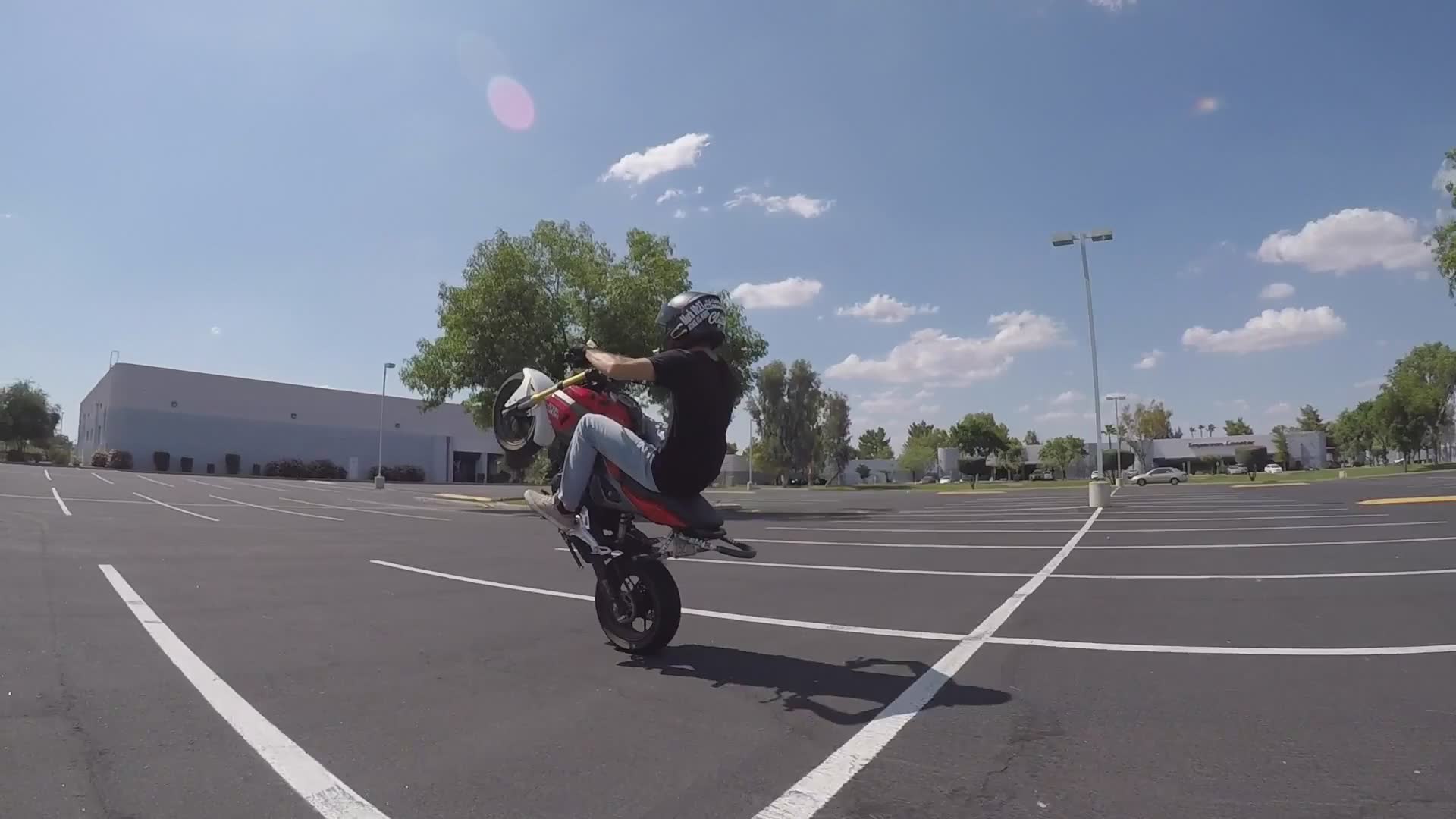 Momentum-based wheelie technique without using clutch
