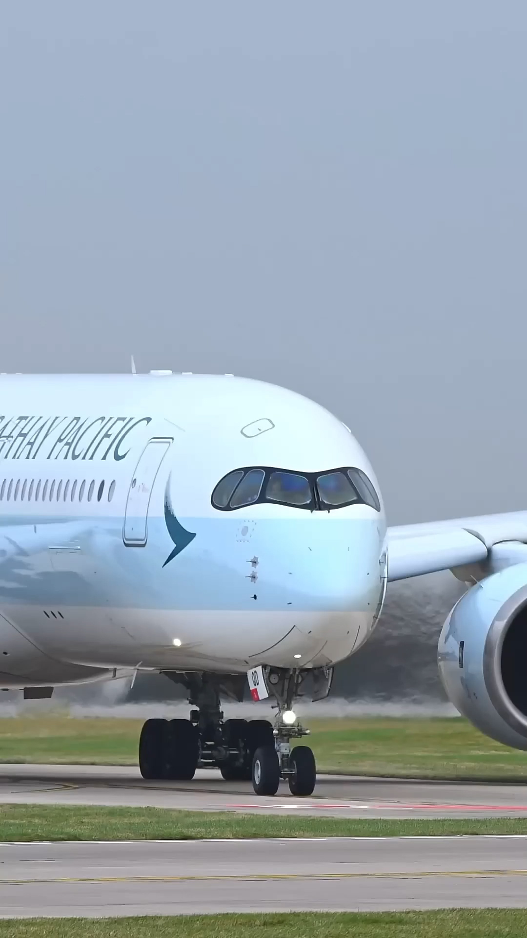 Up close view of Cathay Pacific plane takeoff