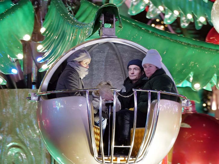Katy Perry & Orlando Bloom take daughter to London Christmas fair
