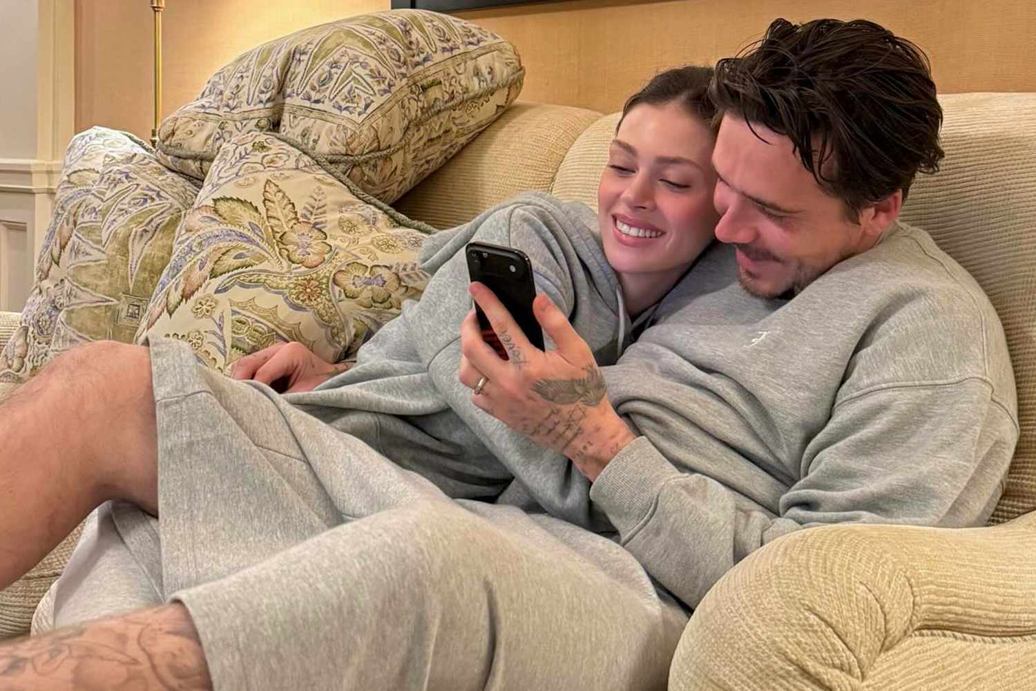 Nicola Peltz Beckham cozies up to husband Brooklyn in matching outfit ...