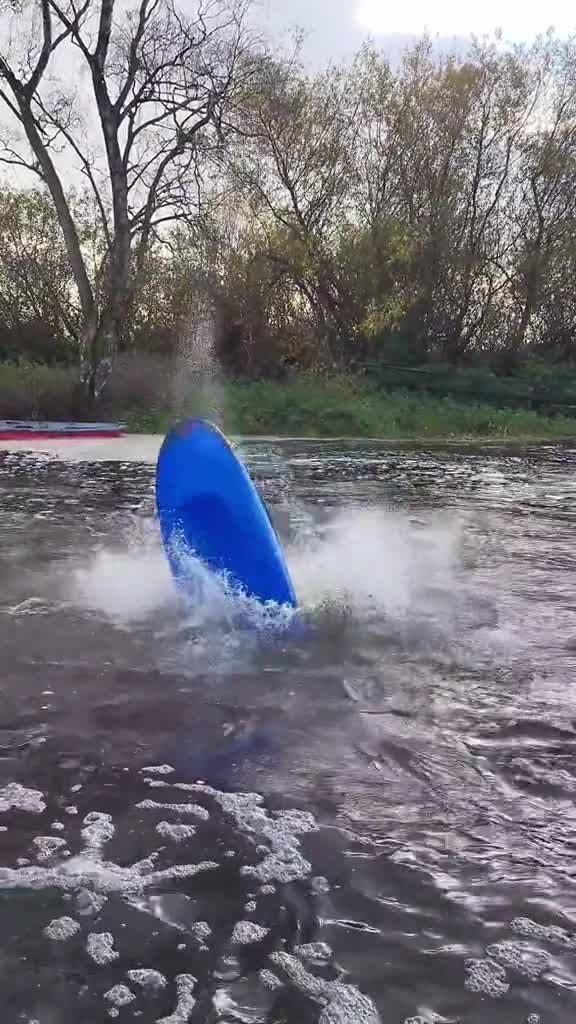 Cold river freestyle kayak flip in one smooth run