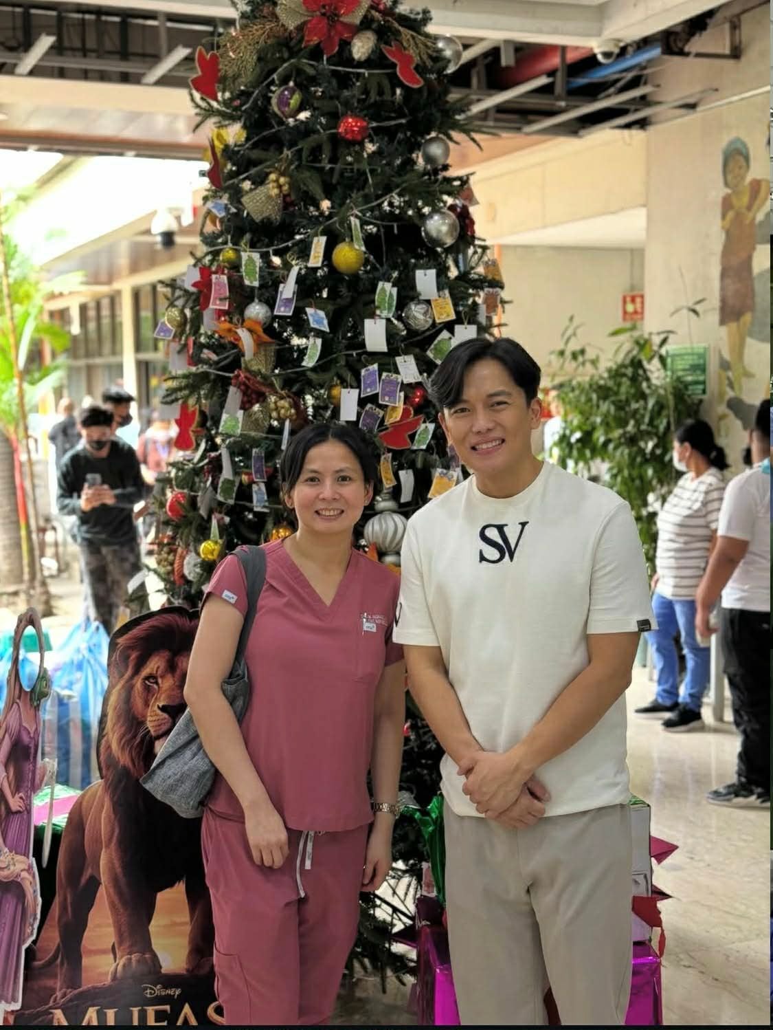 Sam Versoza leads gift-giving activity for children undergoing medical ...