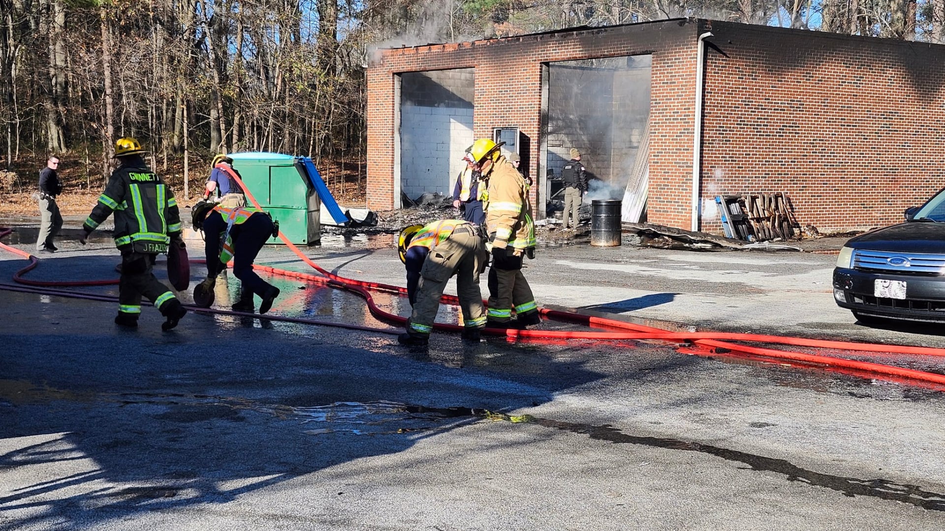 2 men charged in connection to fire at Gwinnett County tire shop