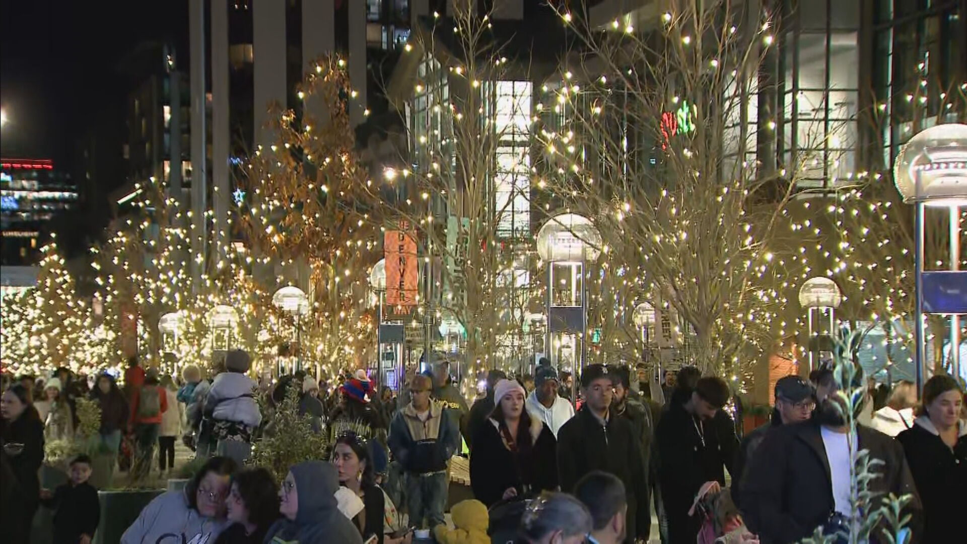 Crowds descend on Denver's 16th Street to ring in the new year