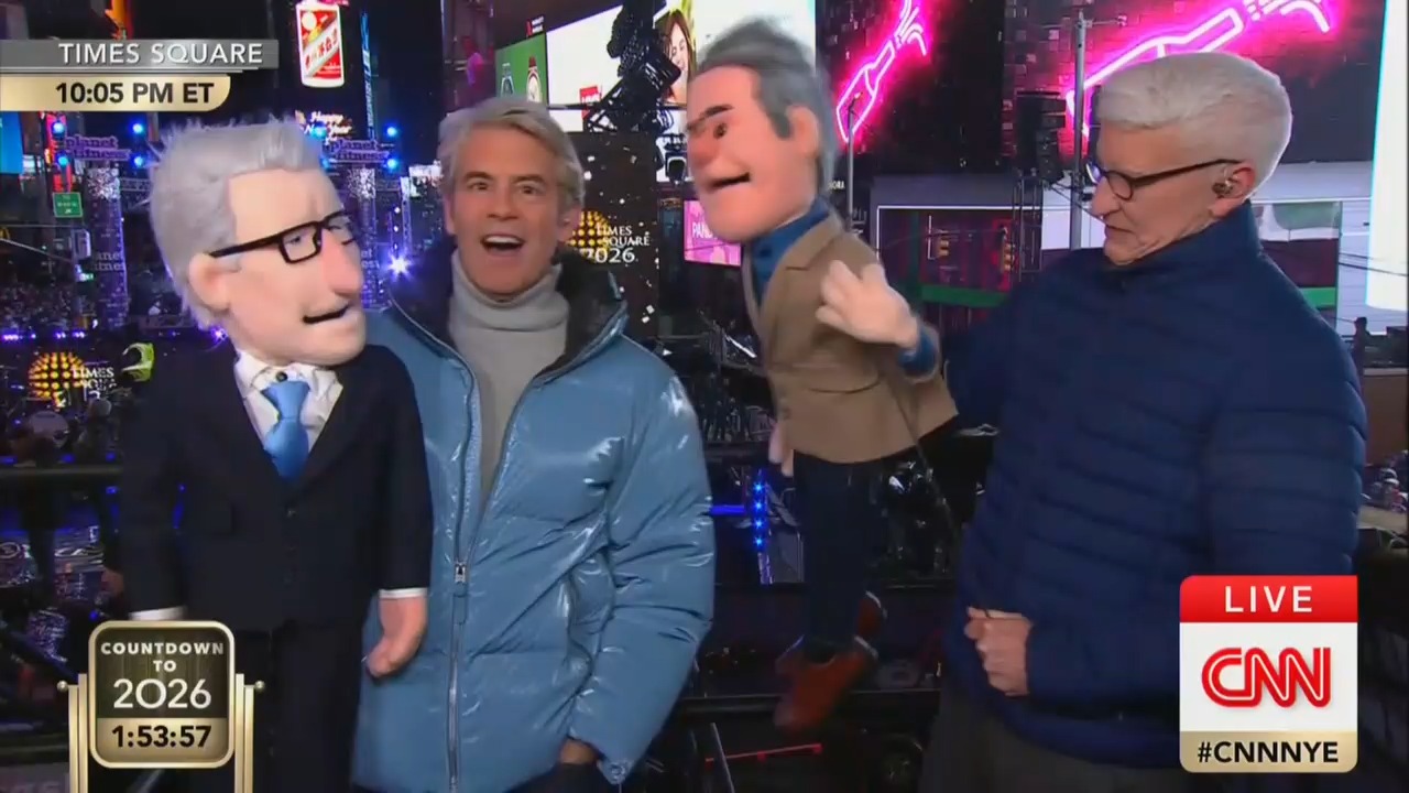Andy Cohen and Anderson Cooper struggle to operate large puppets during ...