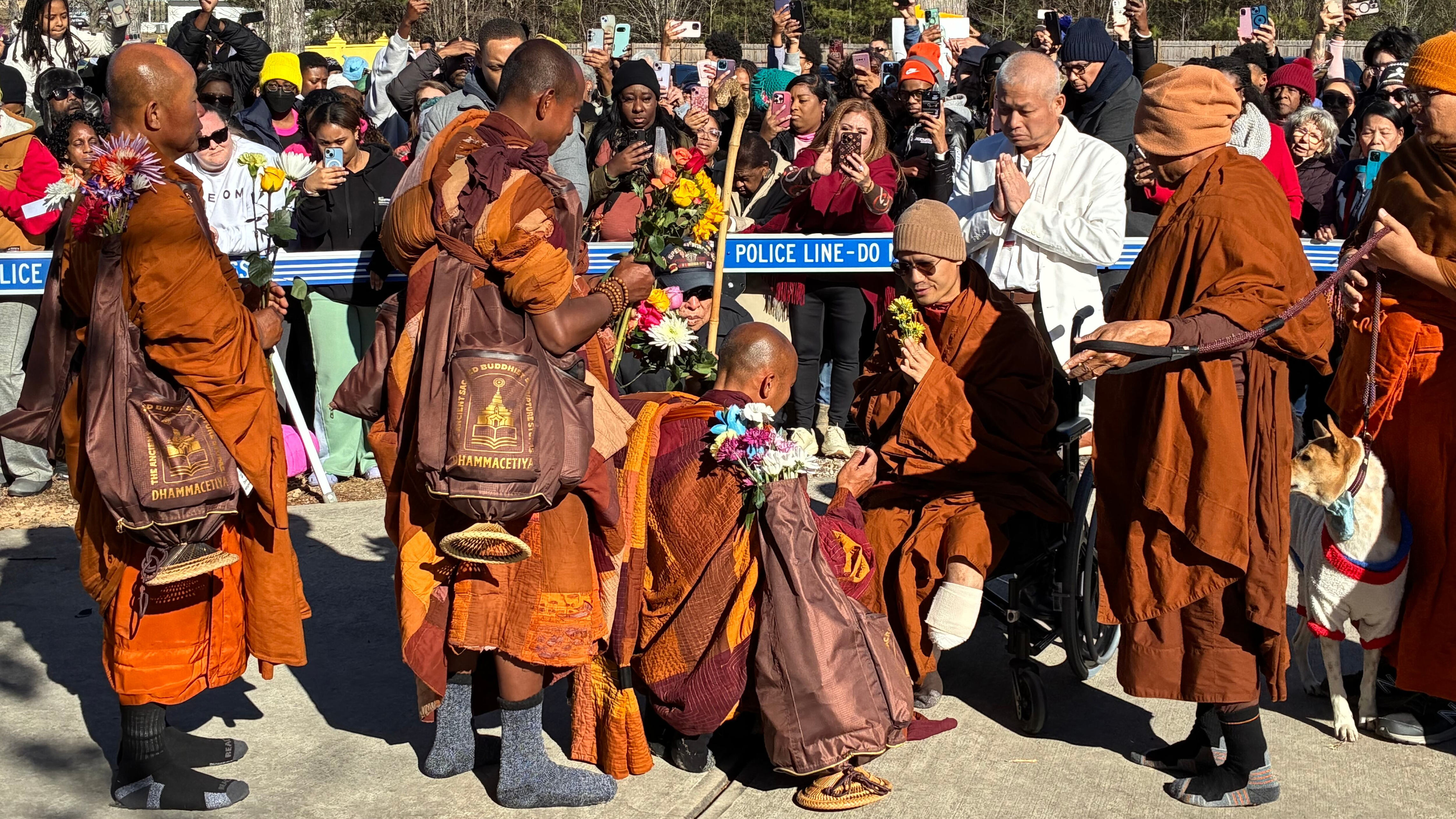 Buddhist monk hit by car during peace walk reunites with fellow monks ...