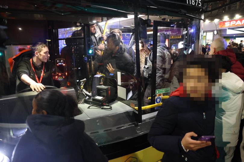 Crowds of revellers queue for buses home after Manchester sees in the ...