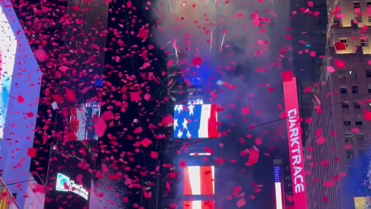 Red, white, blue confetti falls over Times Square with Ray Charles ...