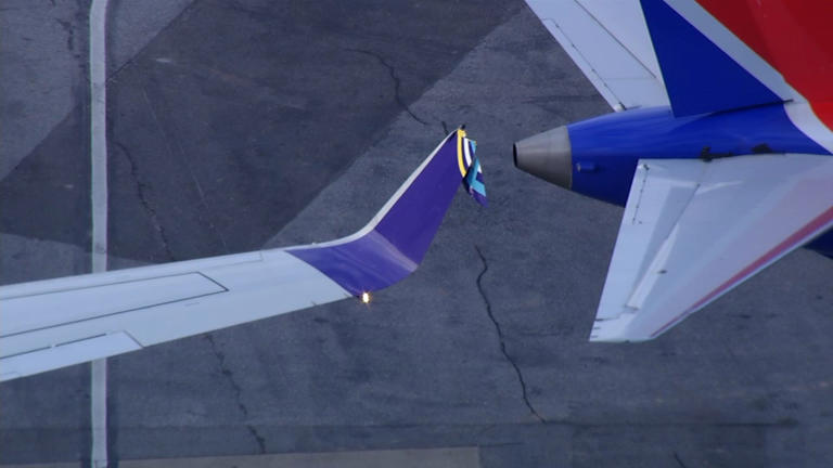 Avelo plane being towed clips wing of parked Southwest plane at RDU