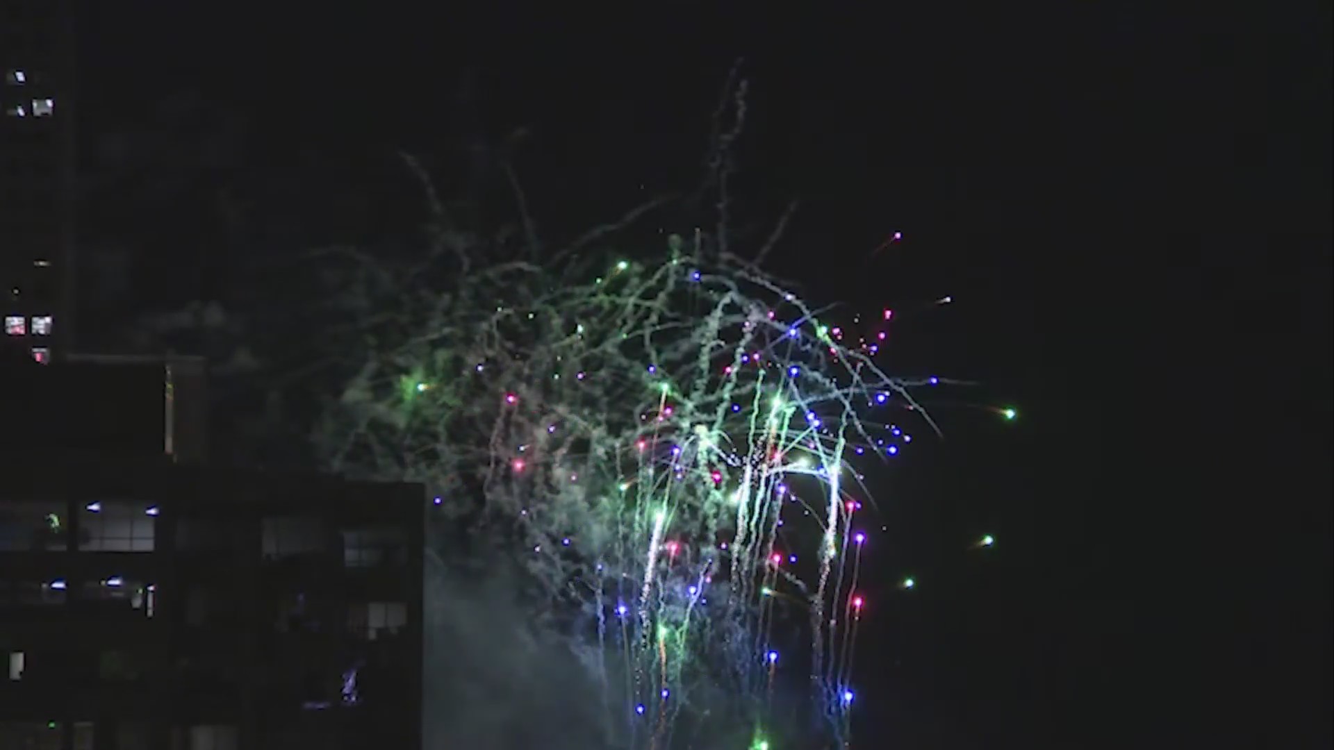 Dozens gather at 16th Street for New Year's Eve fireworks in Denver