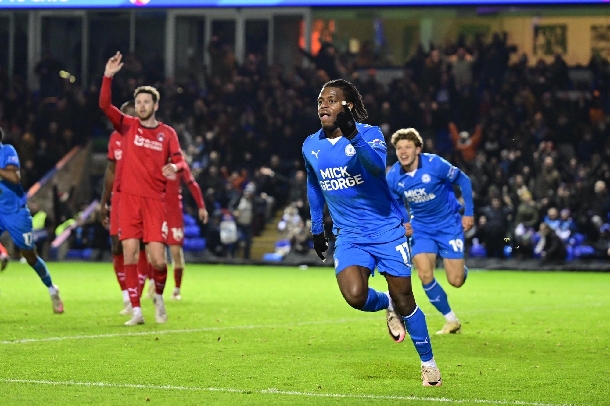 Peterborough United's players worked hard to get another vital victory ...