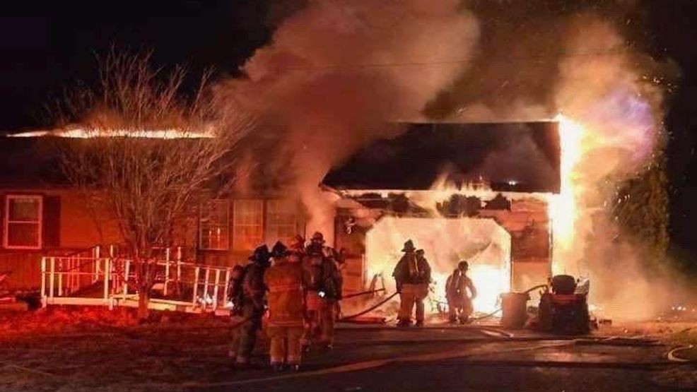 Firefighters help person in wheelchair during Lebanon County house fire