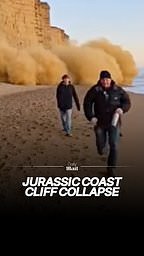 Moment beach walkers run for their lives as cliff collapses
