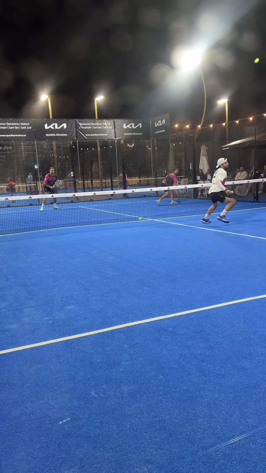 Intense padel match under the night lights