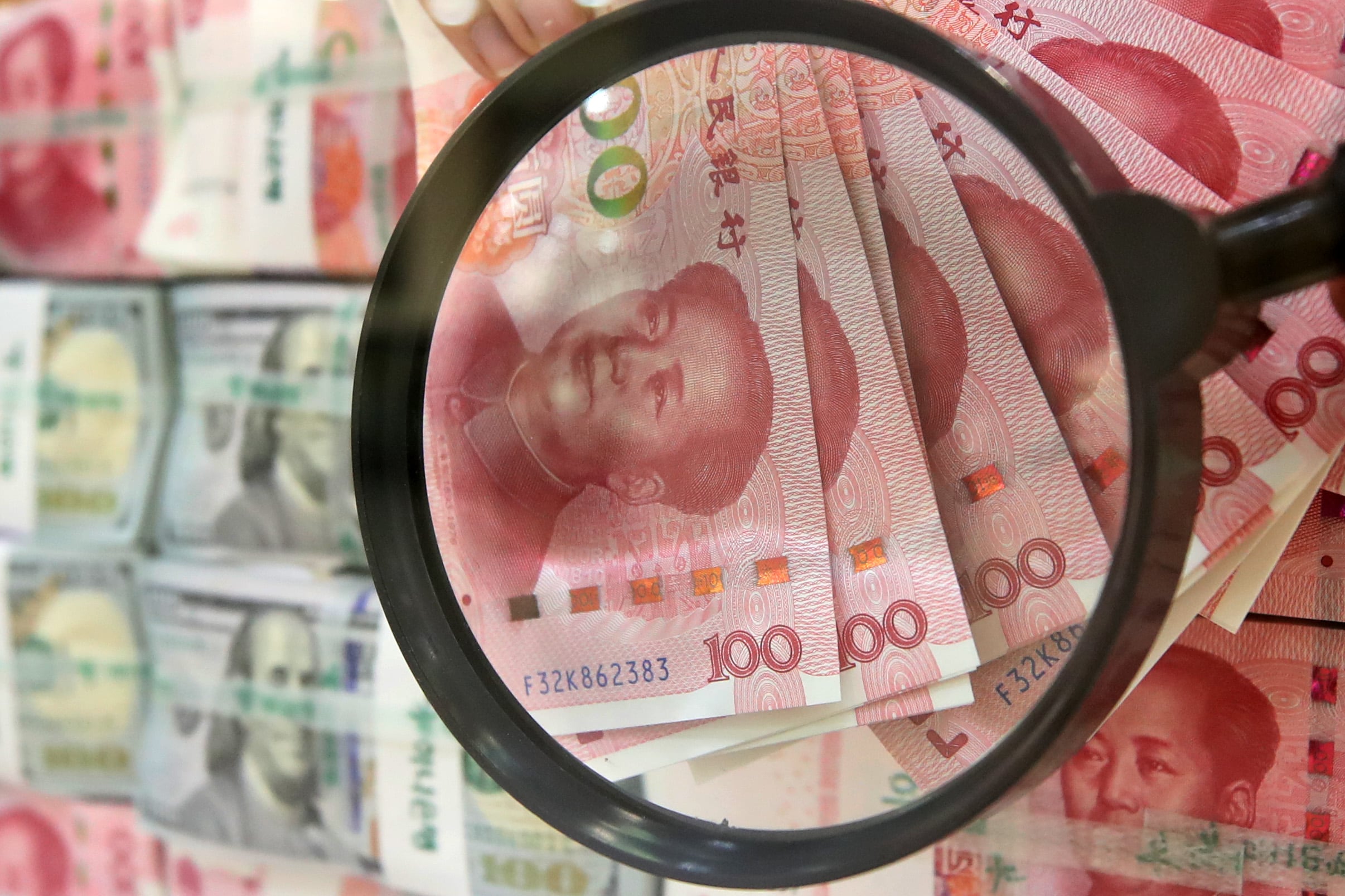 Chinese yuan drops below 7 per dollar