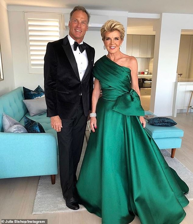 Julie Bishop, 69, shows off her toned arms and taut midriff in chic all ...