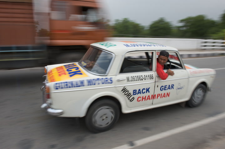 Reverse driver: Indian man drives car backwards on busy highways