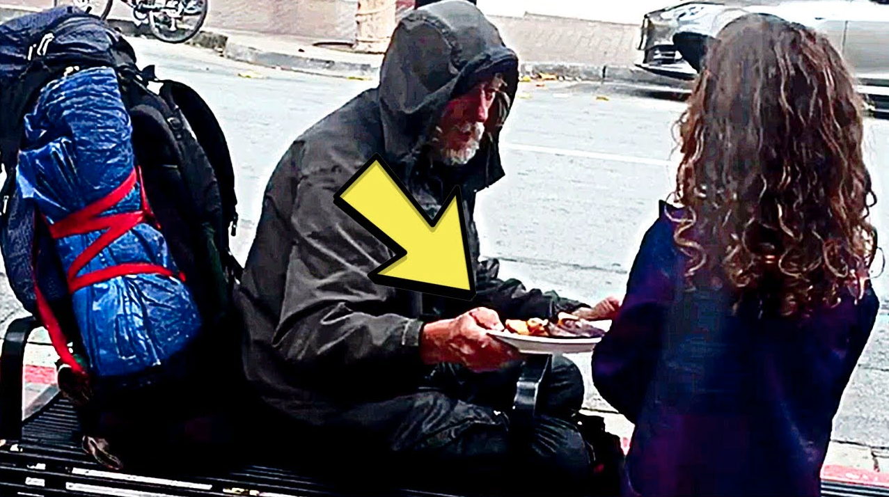 Little girl shares cupcake with garbage man every week