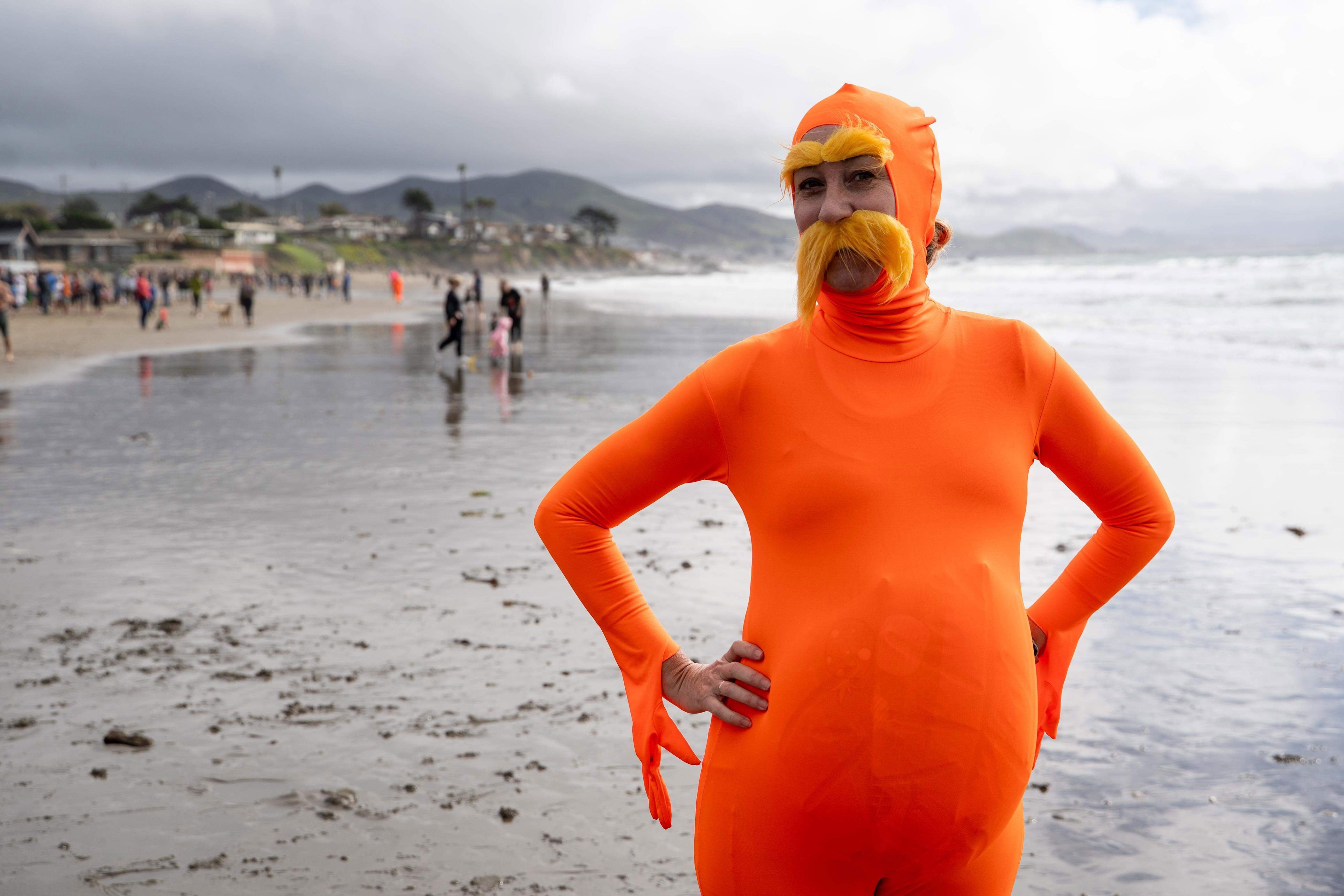 Thousands brave frigid SLO County polar bear dip - despite New Year's rain