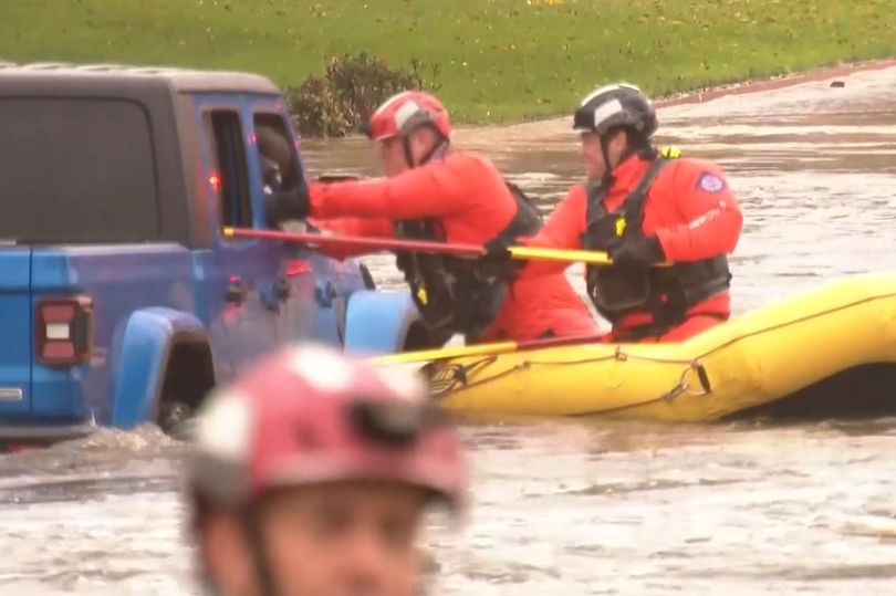 Heart-stopping moment man and child pulled from Jeep swept away by San ...