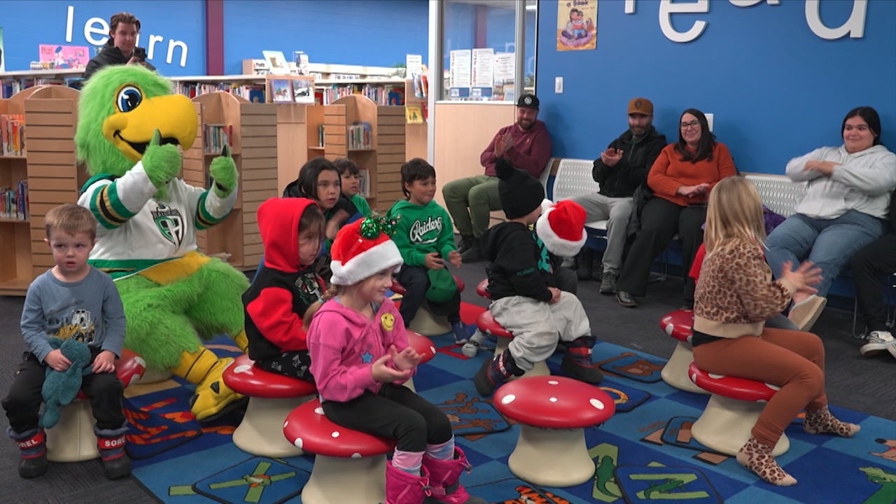 Raiders players swap hockey sticks for storybooks at Prince Albert library