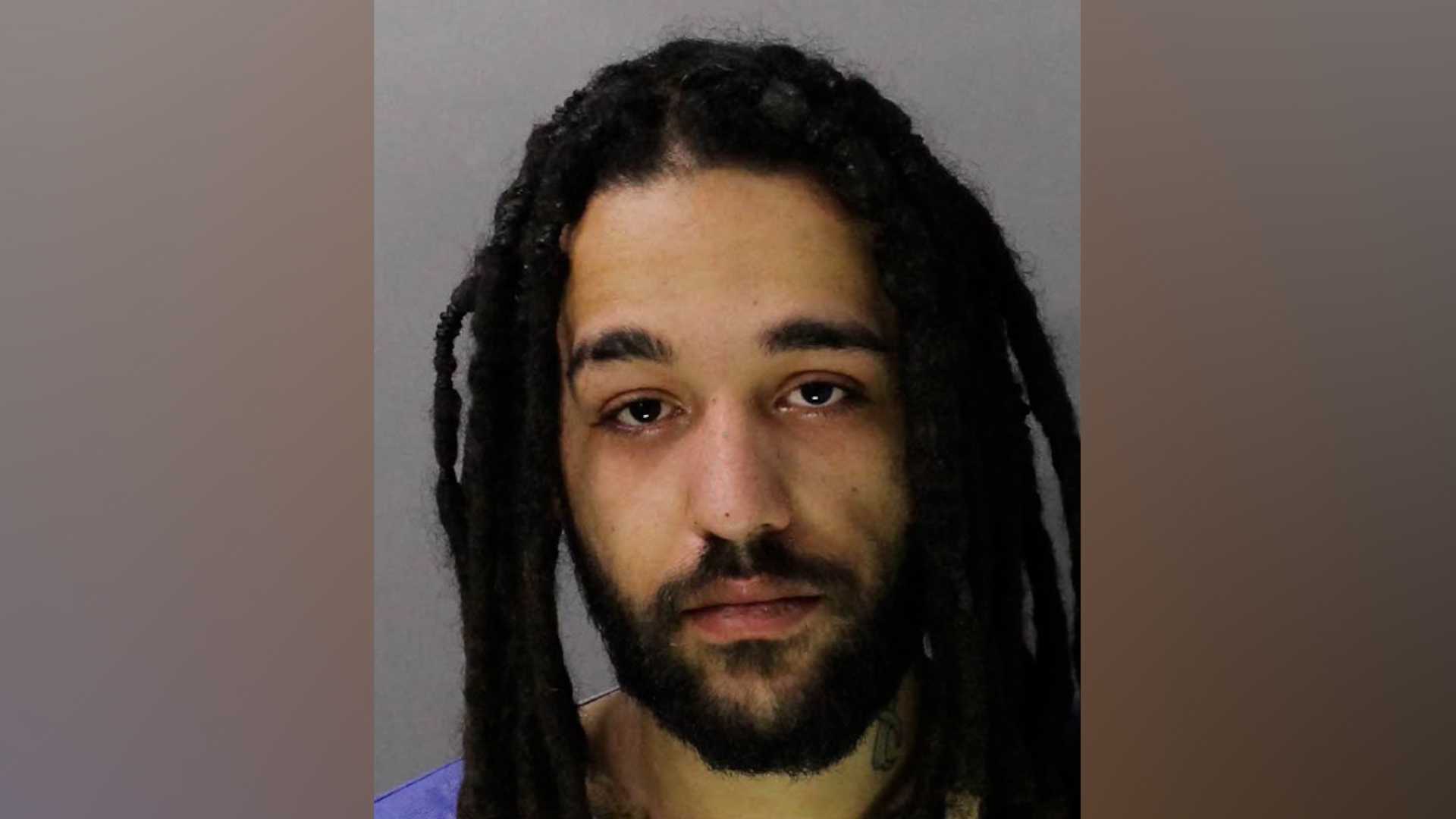 Man accused of grabbing family member by neck, pushing one-year-old